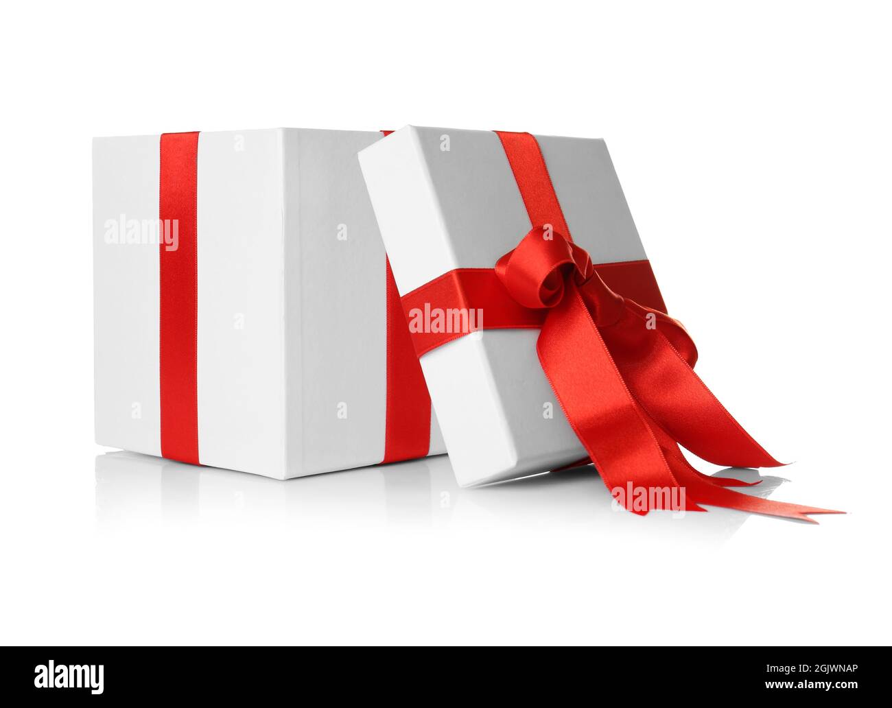 Open gift box with red ribbon on white background Stock Photo - Alamy