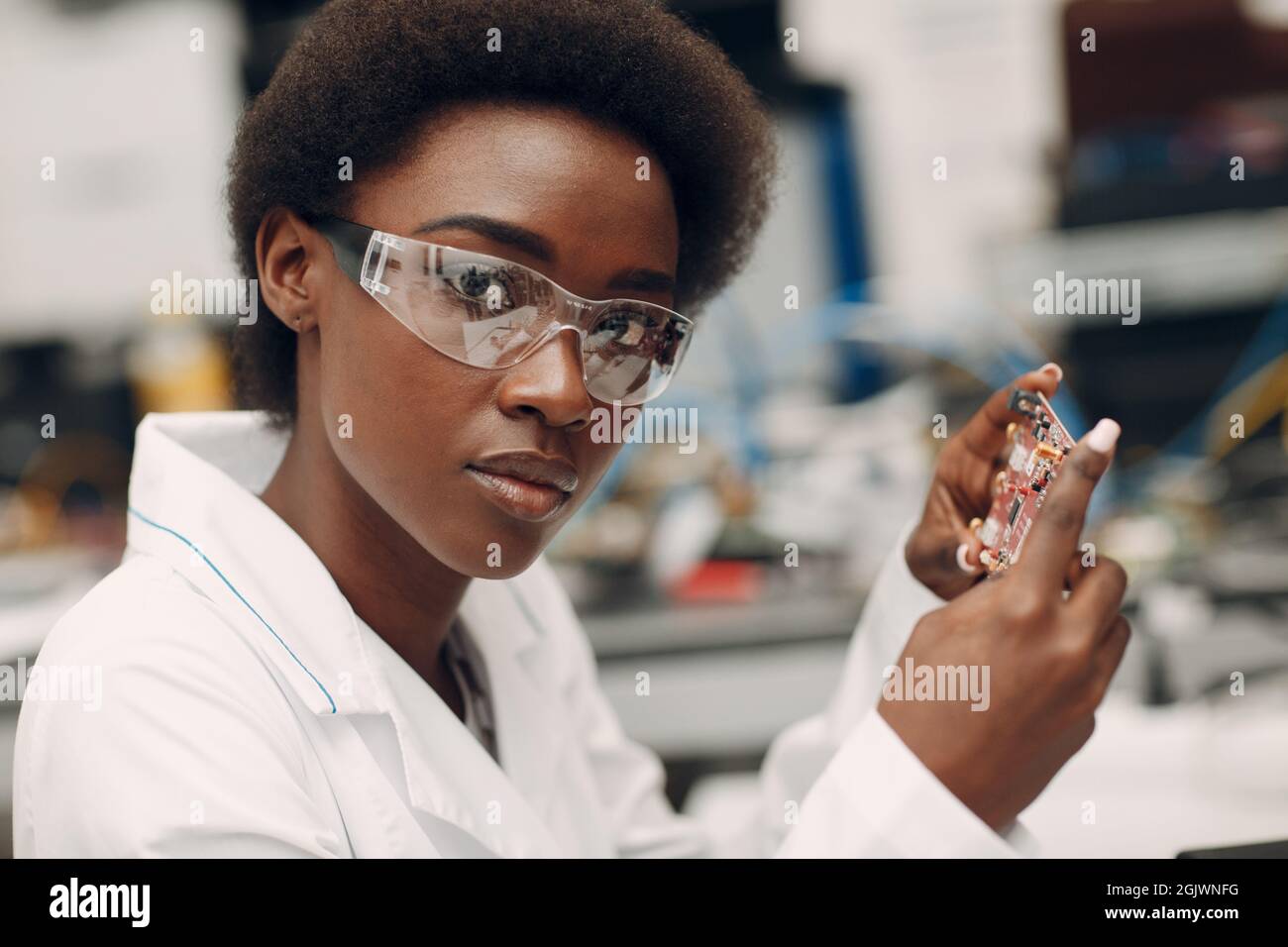 Scientist african american woman working in laboratory with electronic ...