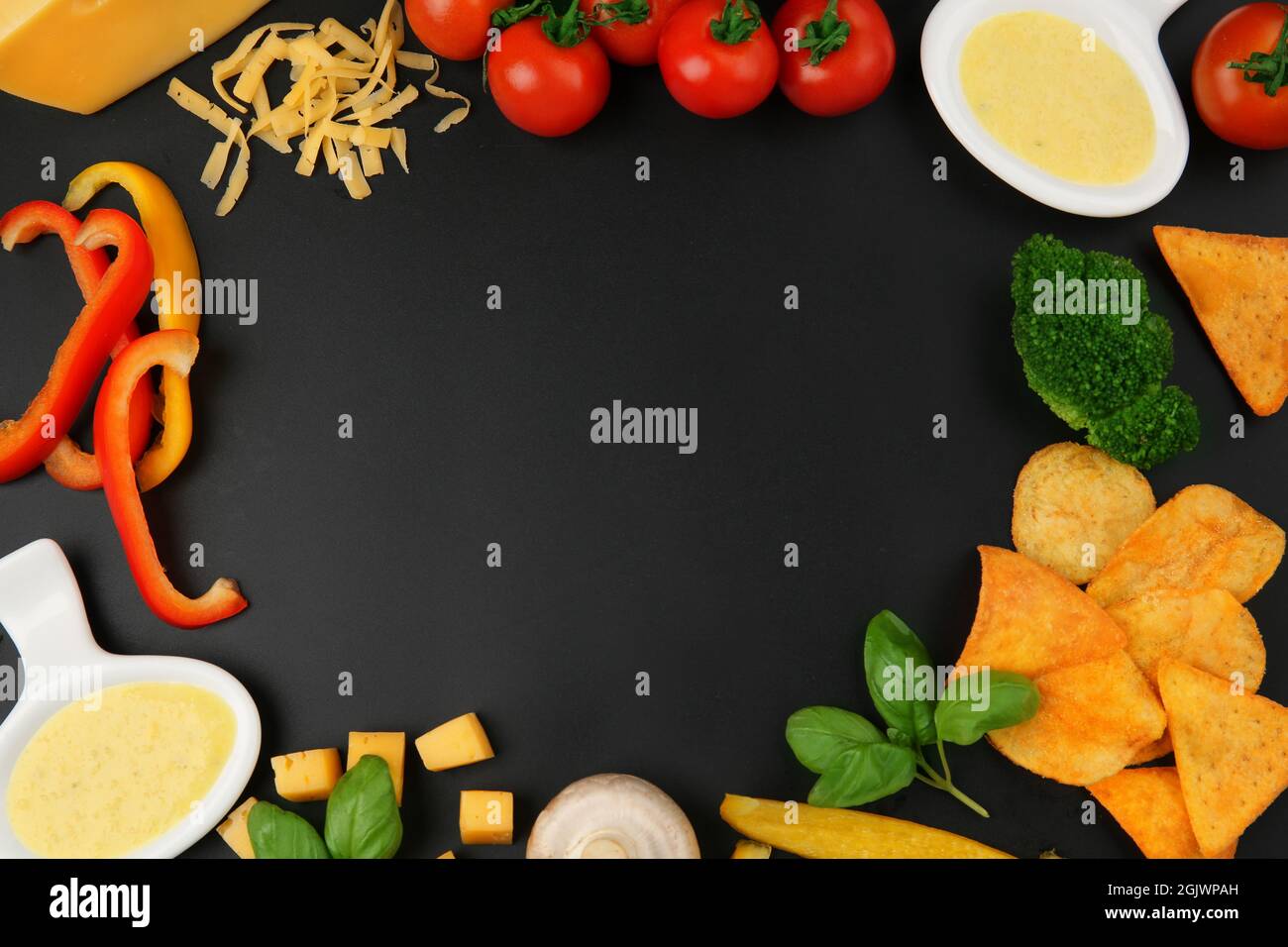 Still life with food ingredients on black background Stock Photo - Alamy