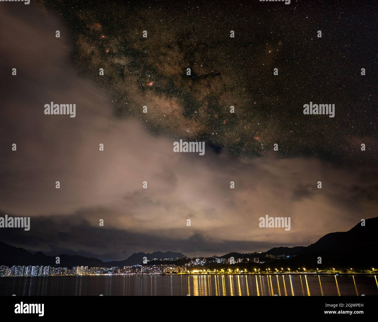 Milky Way over city - Hong Kong Stock Photo - Alamy