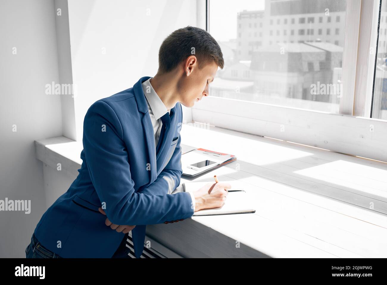business man manager in office near window documents work Stock Photo ...