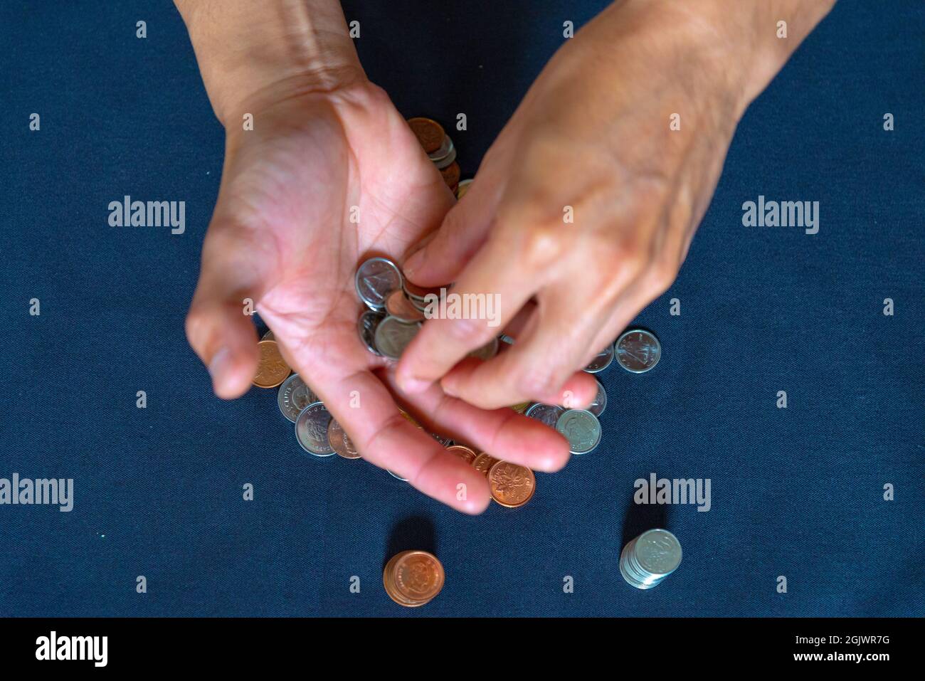 counting coins, coins, penny, cents Stock Photo - Alamy