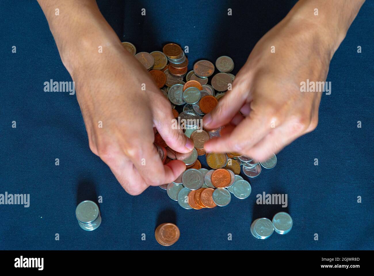 counting coins, coins, penny, cents Stock Photo - Alamy