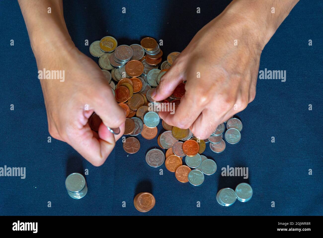 counting coins, coins, penny, cents Stock Photo - Alamy