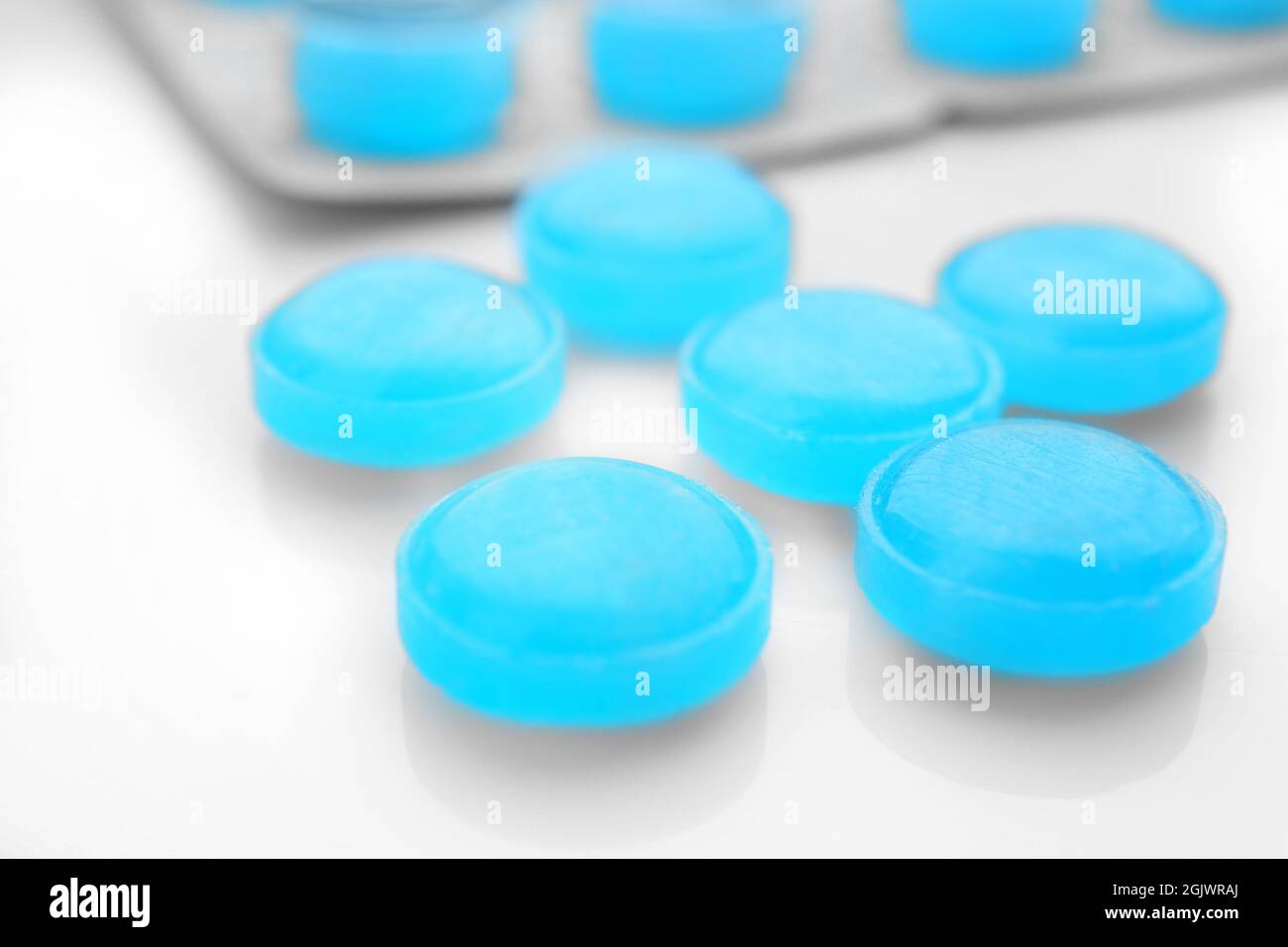 Cough drops on white background Stock Photo - Alamy