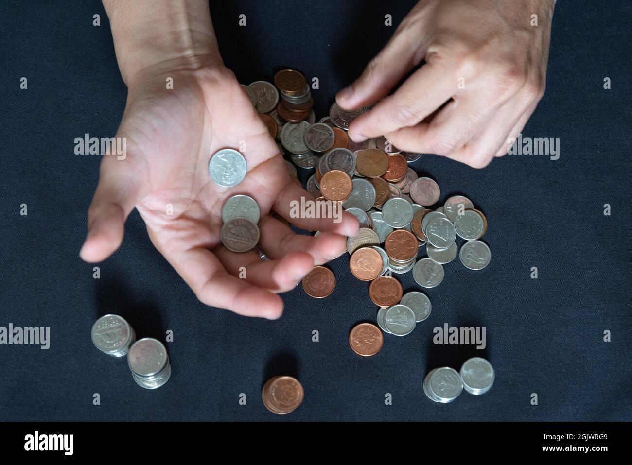counting coins, coins, penny, cents Stock Photo - Alamy