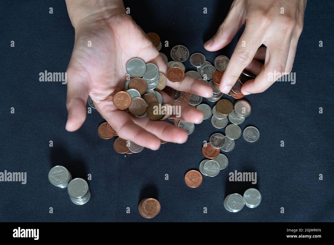 counting coins, coins, penny, cents Stock Photo - Alamy