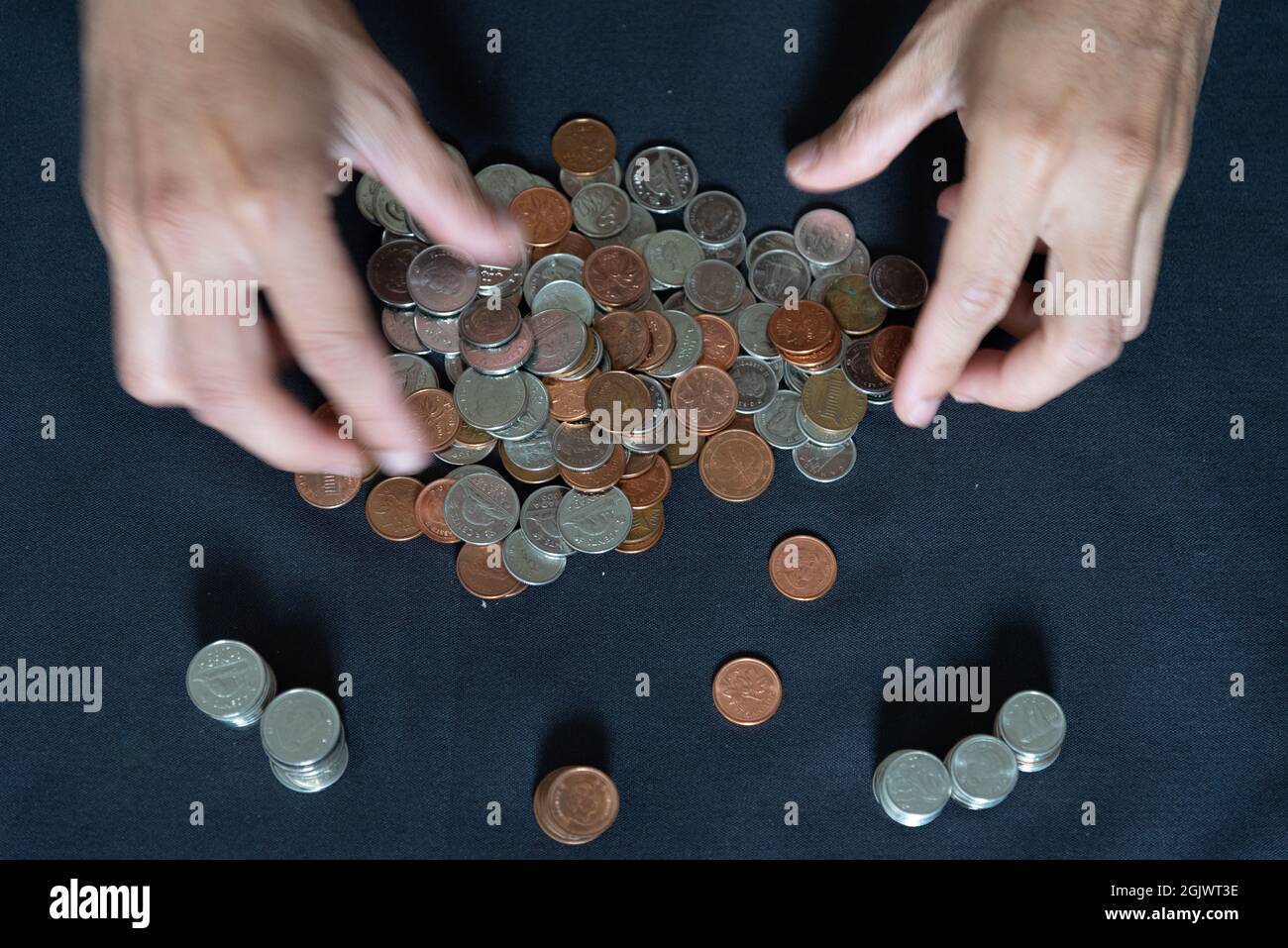 counting coins, coins, penny, cents Stock Photo - Alamy