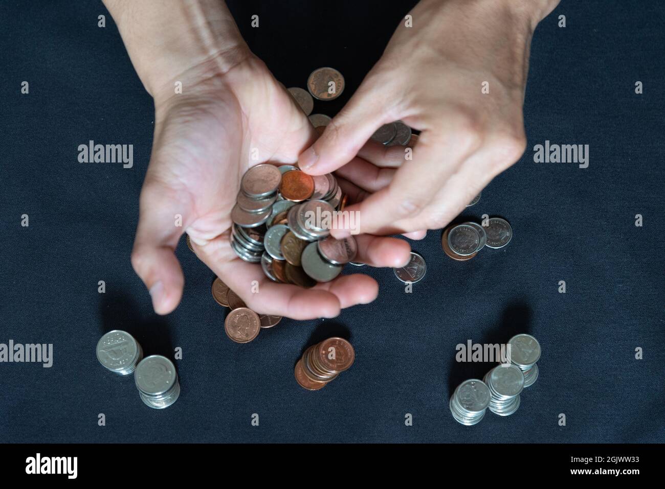counting coins, coins, penny, cents Stock Photo - Alamy