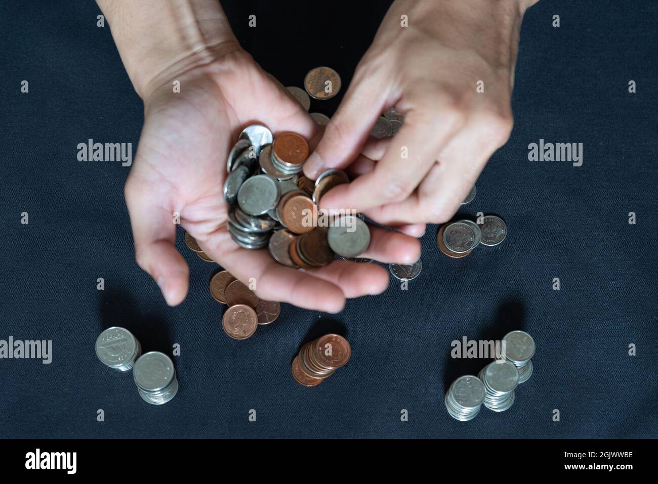 counting coins, coins, penny, cents Stock Photo - Alamy