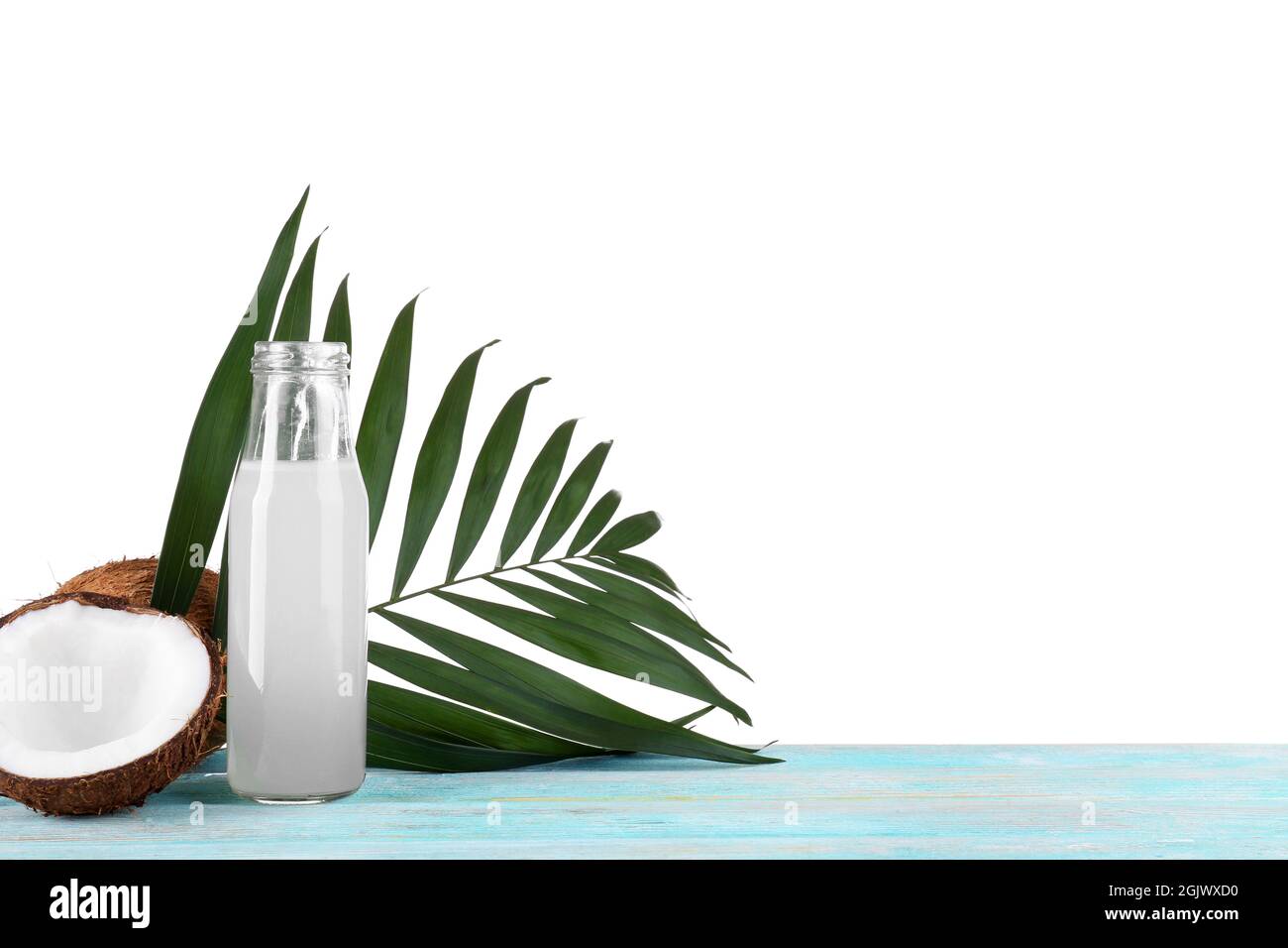 Bottle of coconut water and fresh nut on white background Stock Photo ...