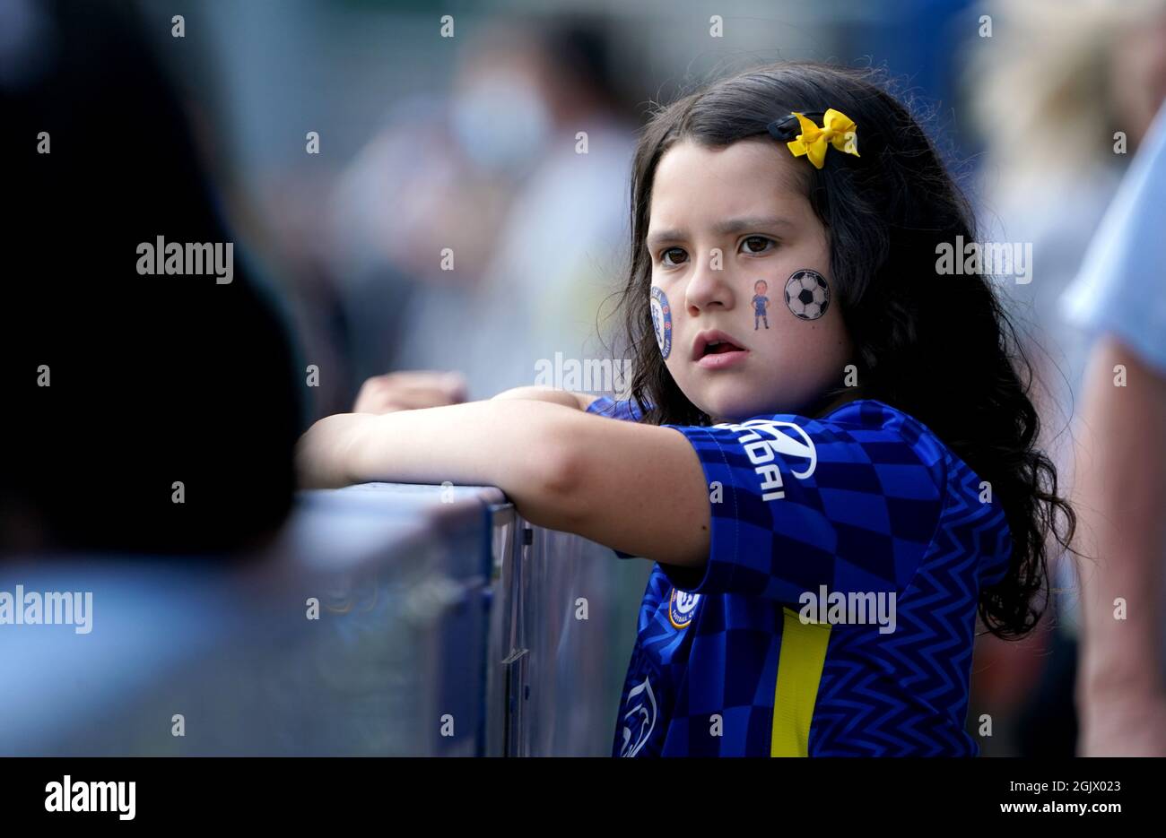 A young Chelsea fan watches the warm-up before the FA Women's Super ...