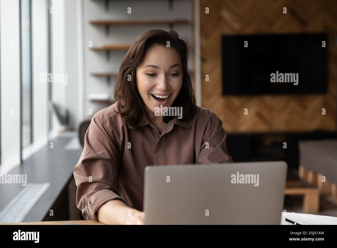 Excited woman employee triumph hi-res stock photography and images - Alamy