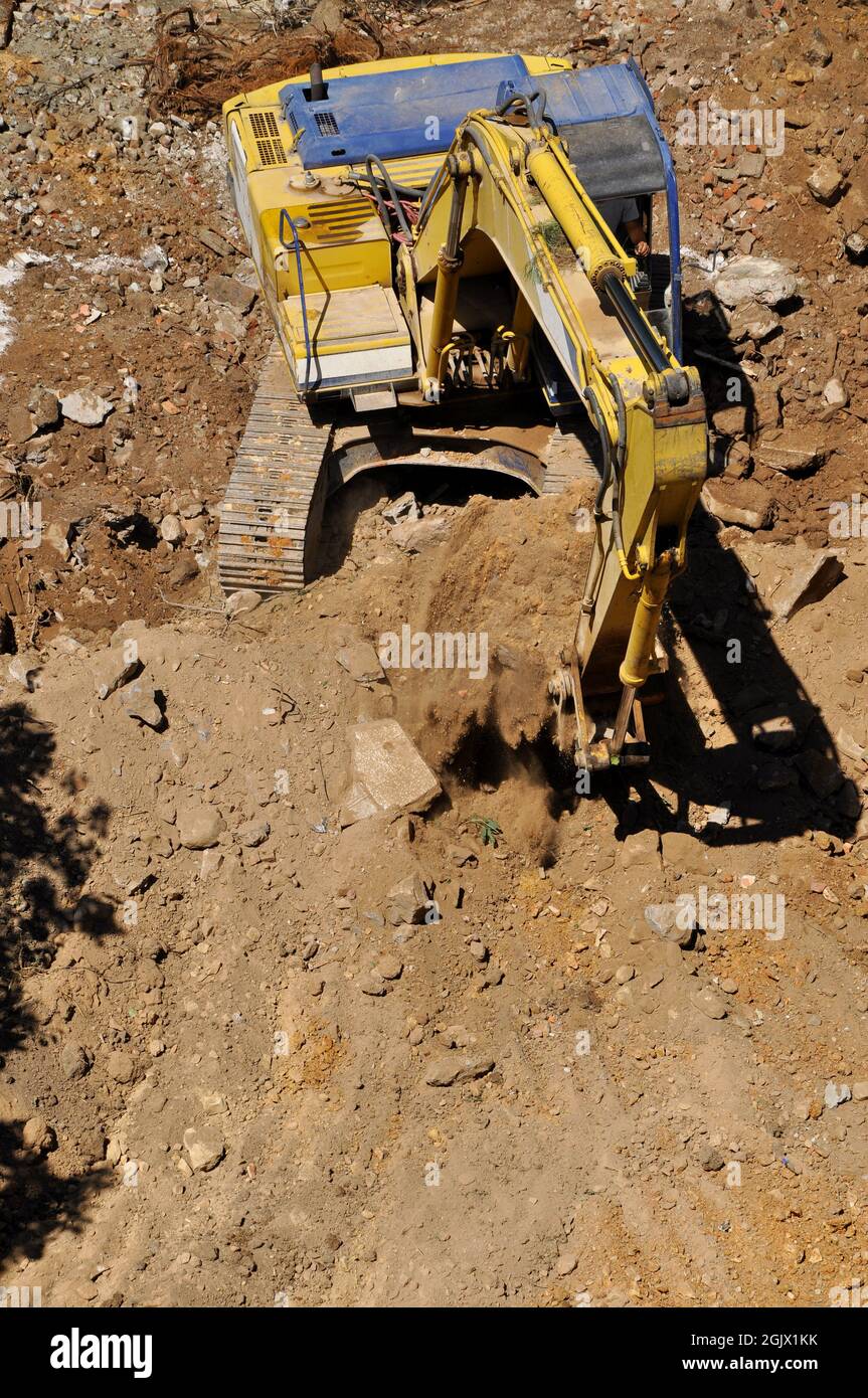 Excavator continues to work at the construction site, excavation site ...