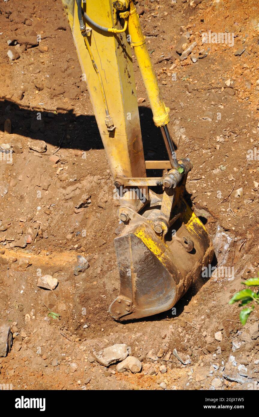 Excavator continues to work at the construction site, excavation site ...