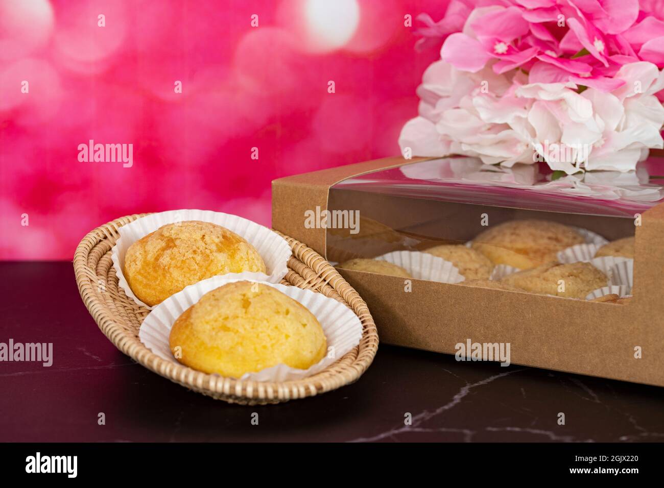 A small tray full of Japanese Cream Puff with the delivery box ...