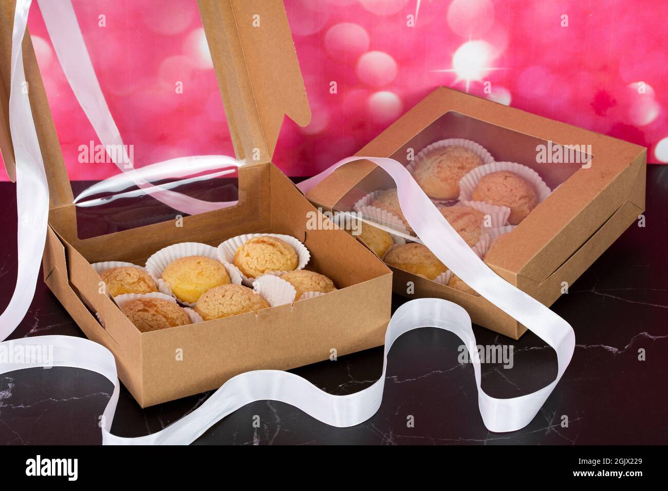 A tray full of Japanese Cream Puff with the delivery box and loose ...