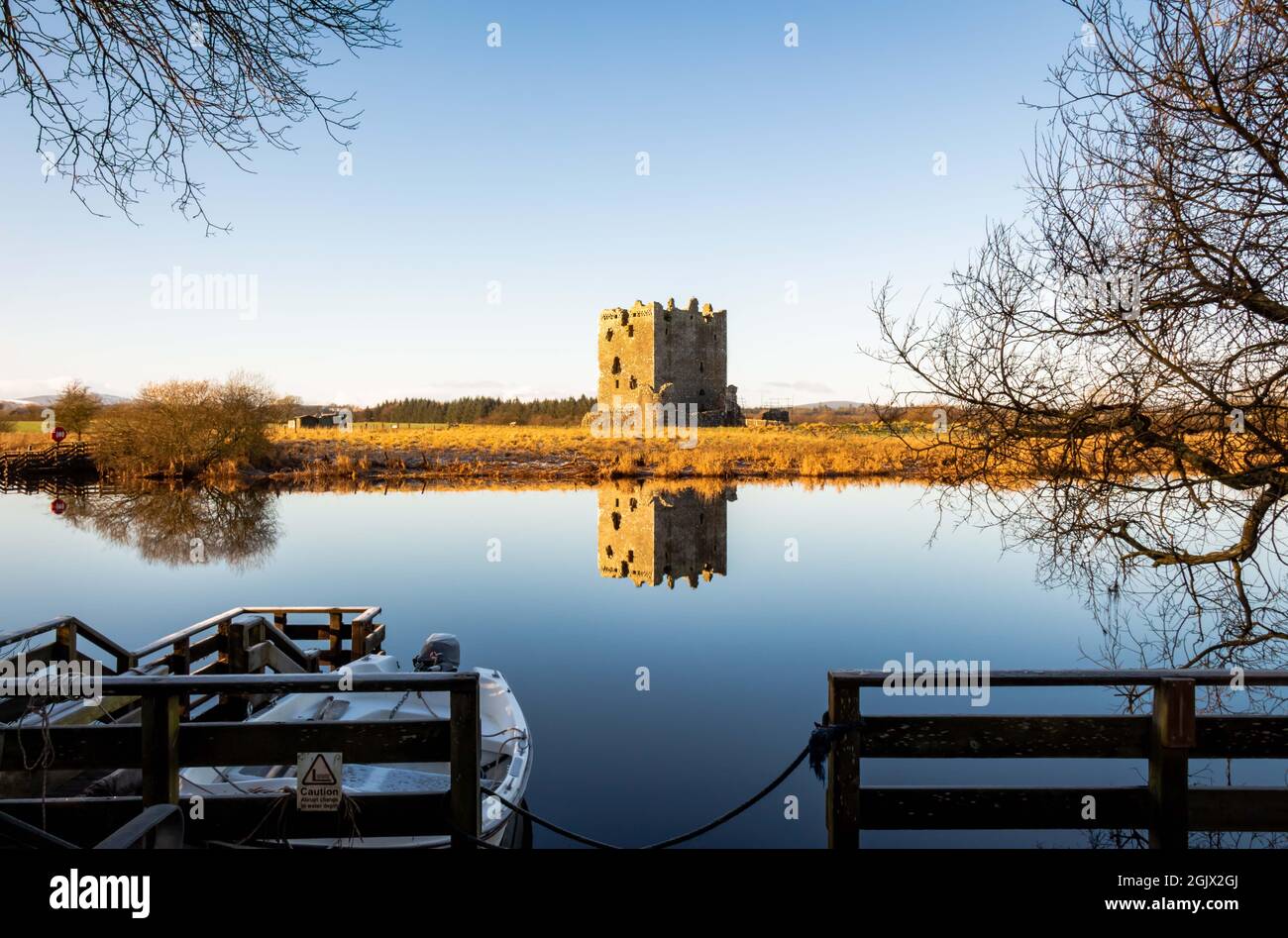 The boat crossing at Threave Castle, reflecting on the River Dee in the ...