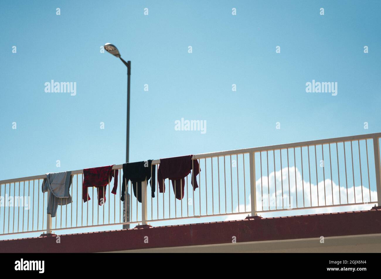 Laundry hanging on fence hi-res stock photography and images - Alamy