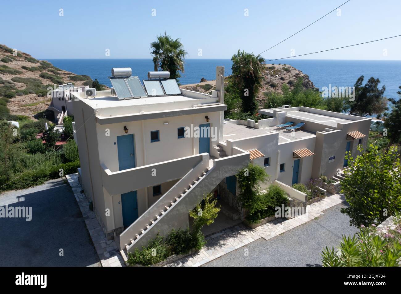 A resort town on the mountains in Crete, Greece Stock Photo - Alamy