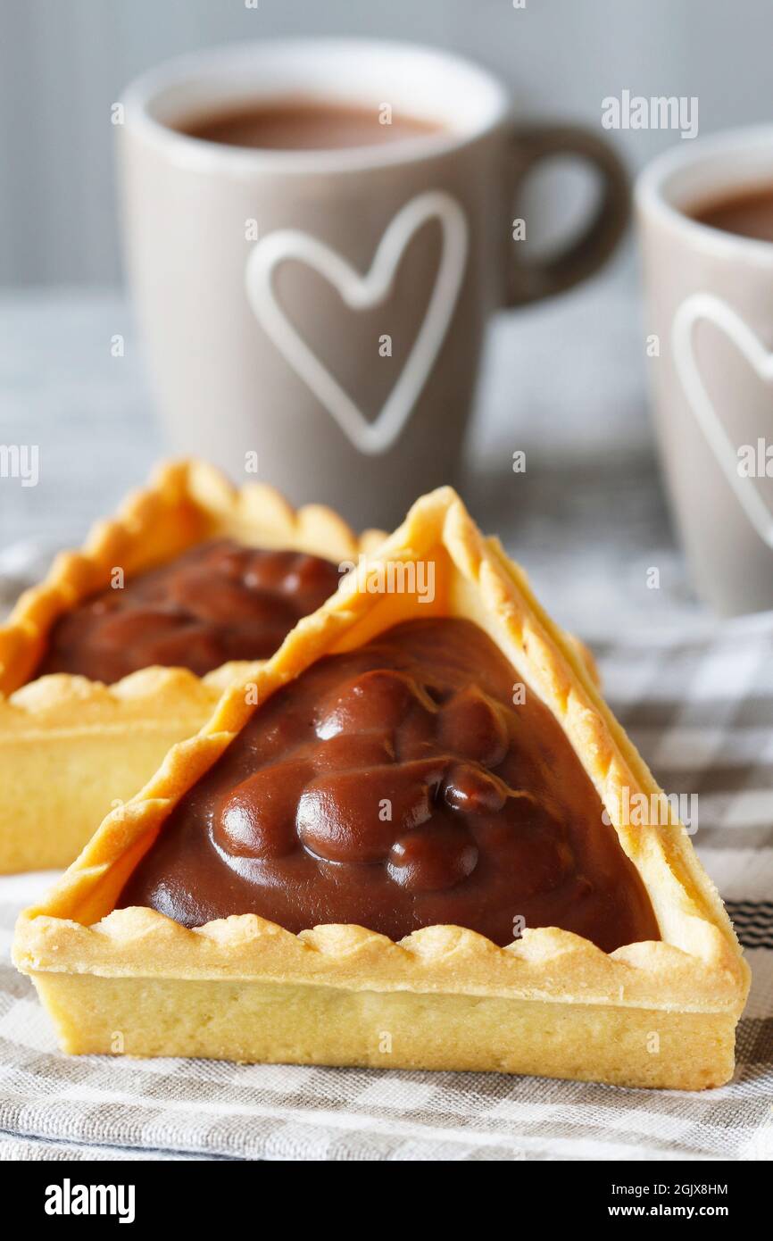 Chocolate triangles cookies. Party dessert Stock Photo - Alamy