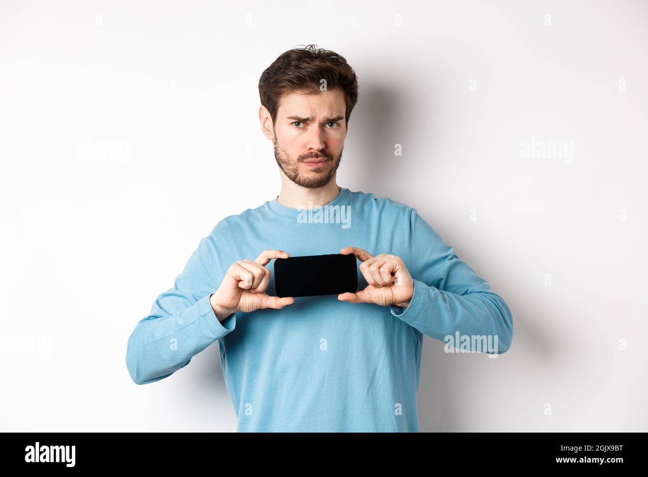 E-commerce and shopping concept. Sad and disappointed guy complaining ...