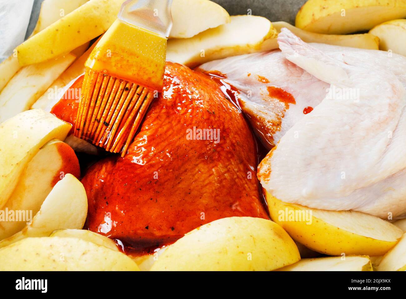 Preparing poultry for baking. Marinated meat. Party dish Stock Photo ...