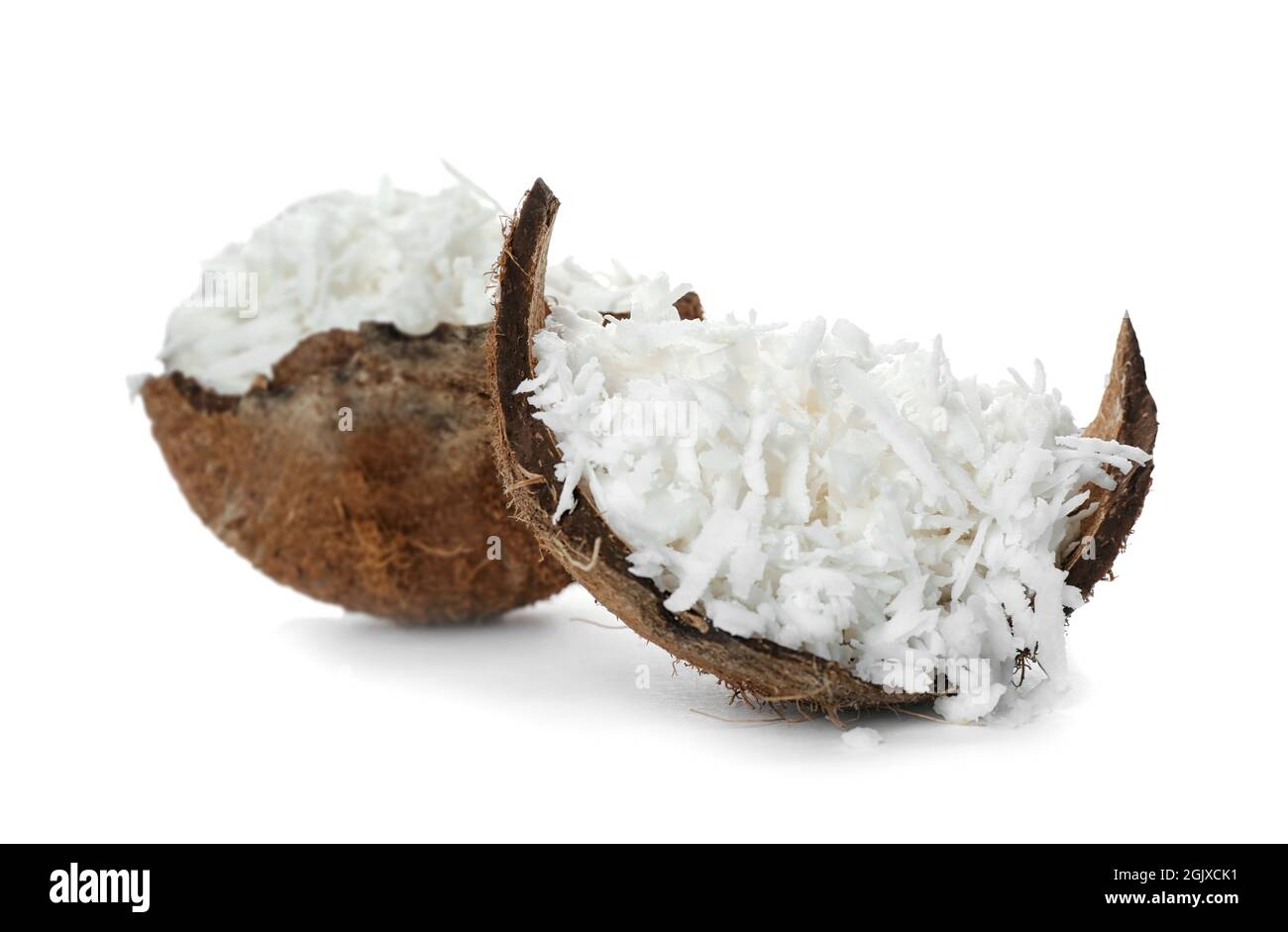 Coconut flakes and fresh nut on white background Stock Photo - Alamy
