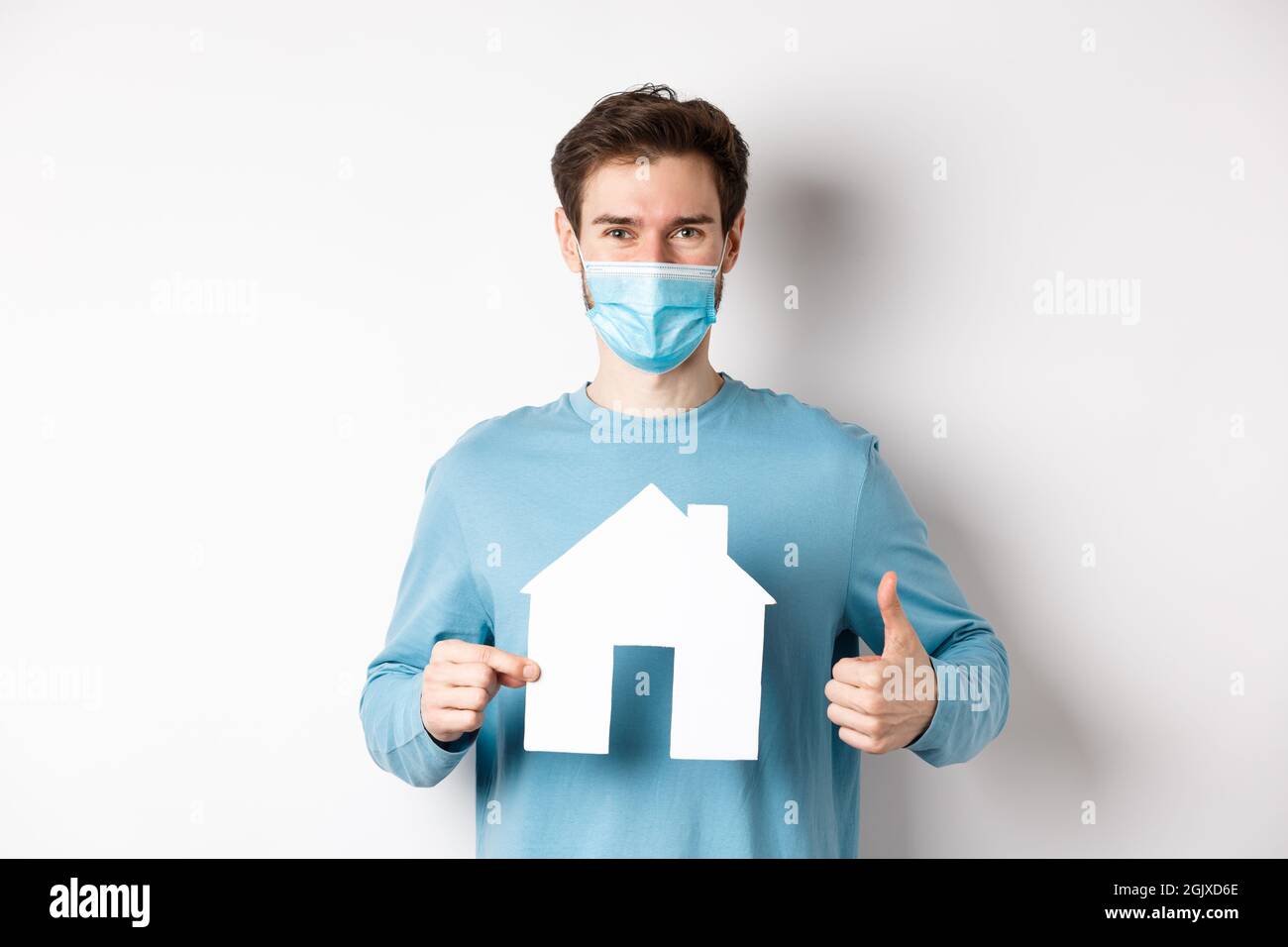 Covid and real estate concept. Smiling agency client showing thumb up ...