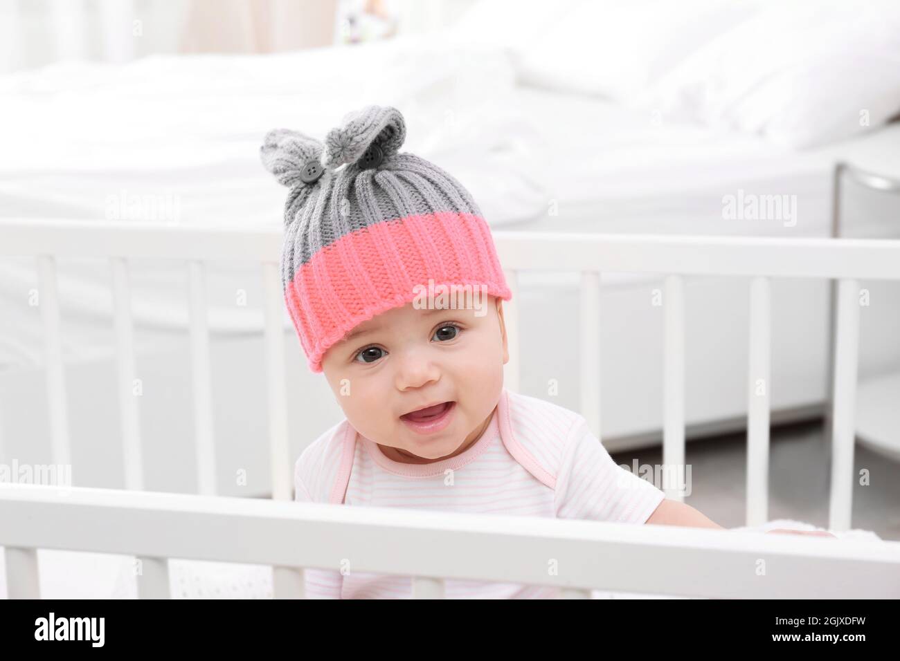 Cute little baby in cradle at home Stock Photo - Alamy