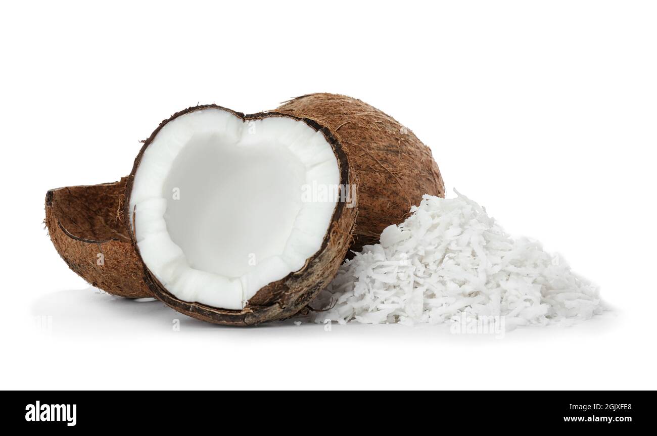 Heap of coconut flakes and fresh nut on white background Stock Photo ...