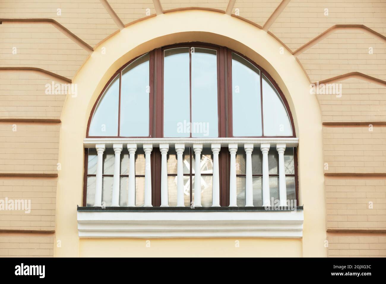 Arched window with sand wall background Stock Photo - Alamy