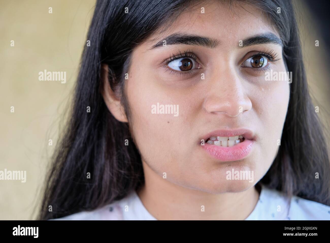 An Indian lady with an angry face expression Stock Photo - Alamy