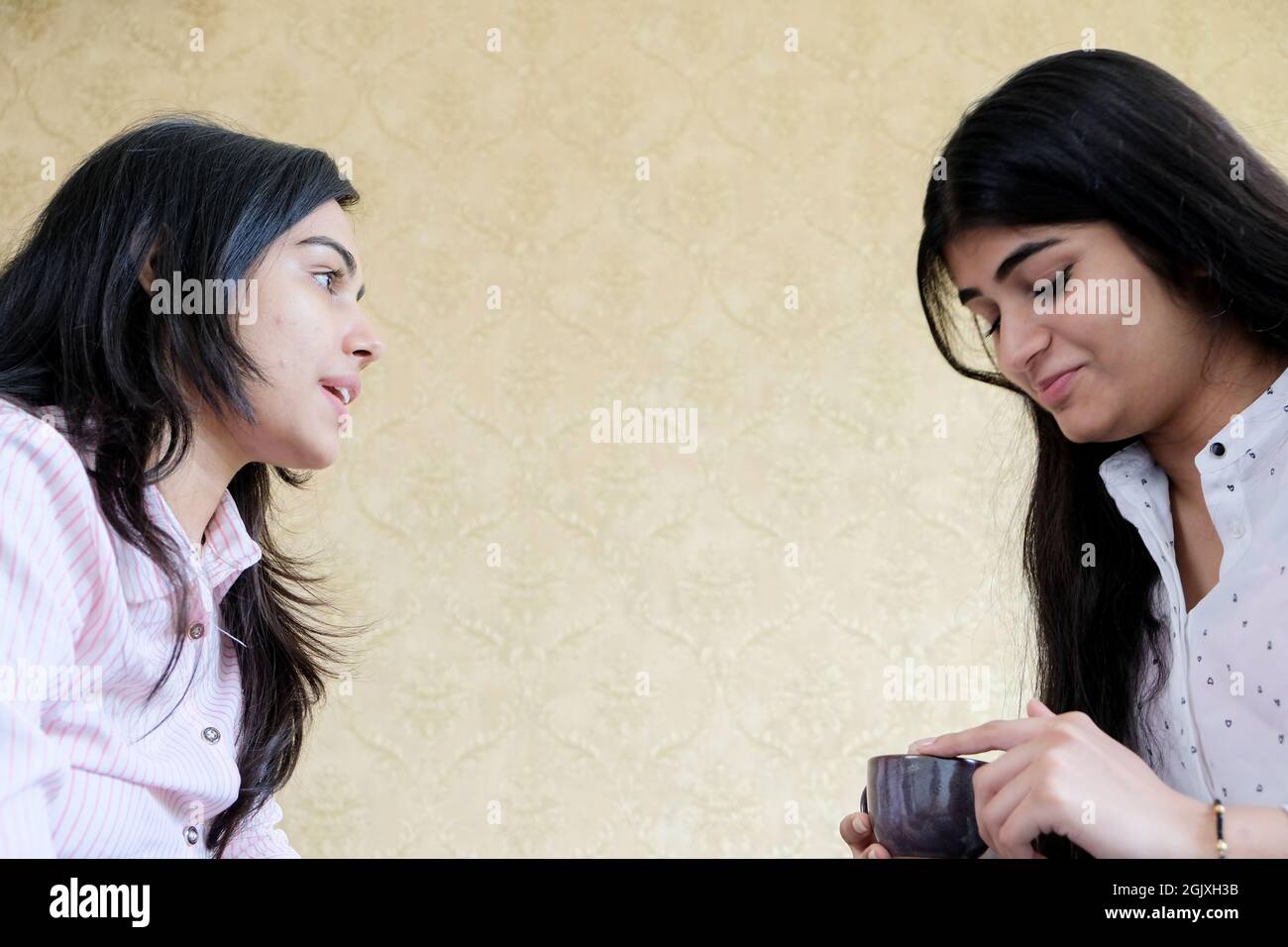 Two Indian best friends talking about life at home Stock Photo - Alamy