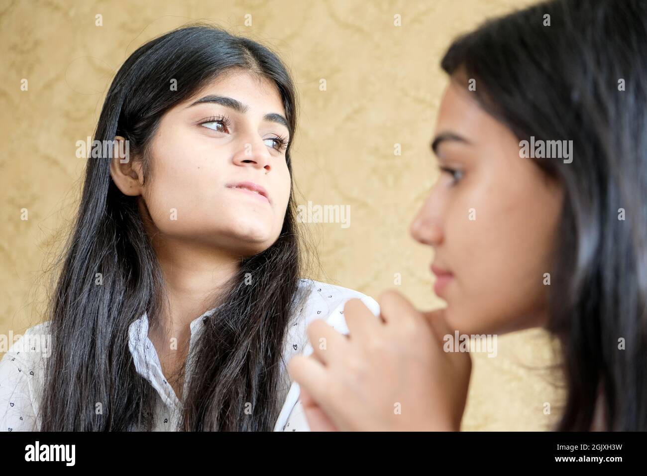 Two Indian best friends talking about life at home Stock Photo - Alamy