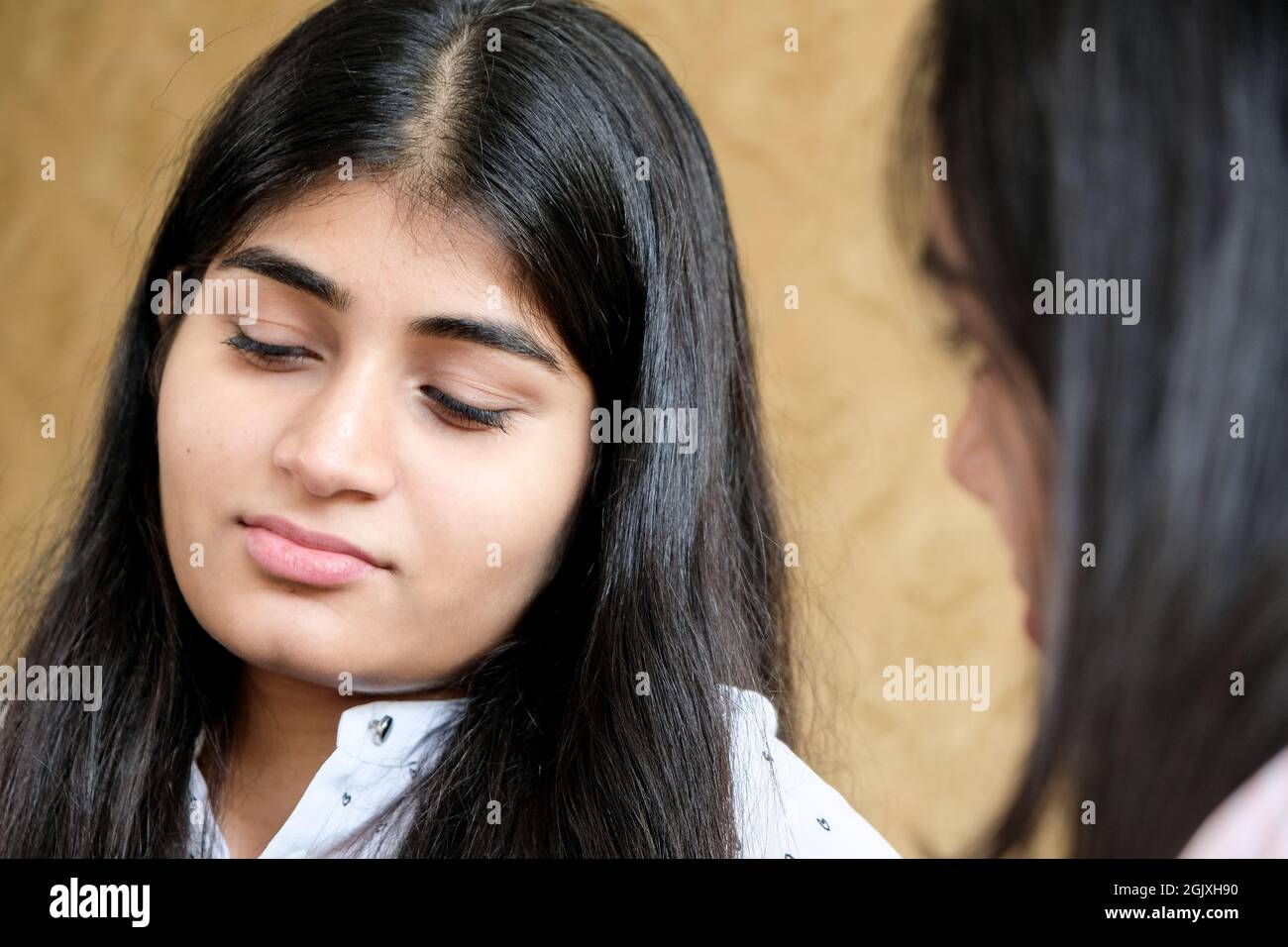 Two Indian best friends talking about life at home Stock Photo - Alamy