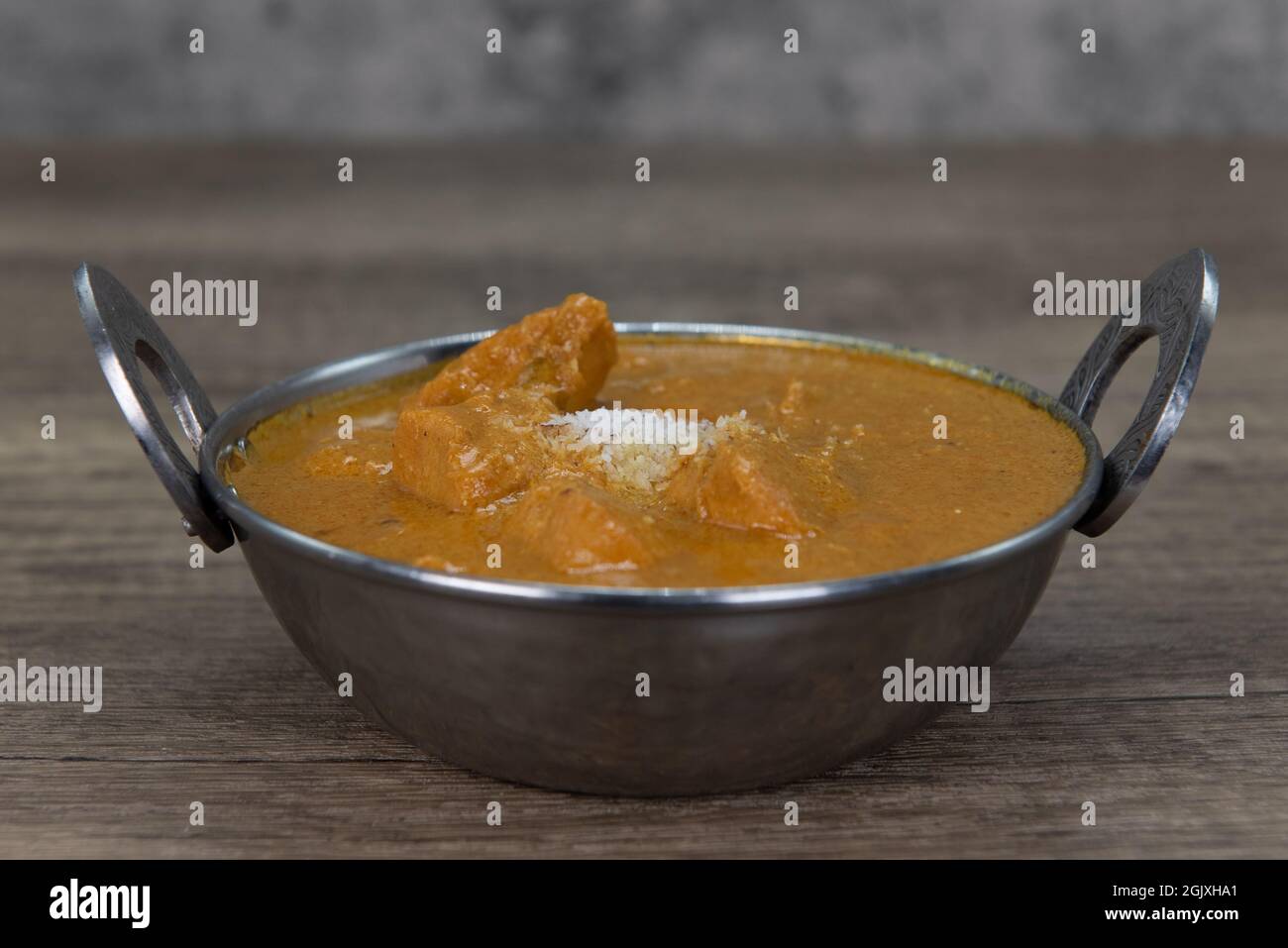 Cocnut curry flavored chicken meat in a bowl from Indian restaurant ...