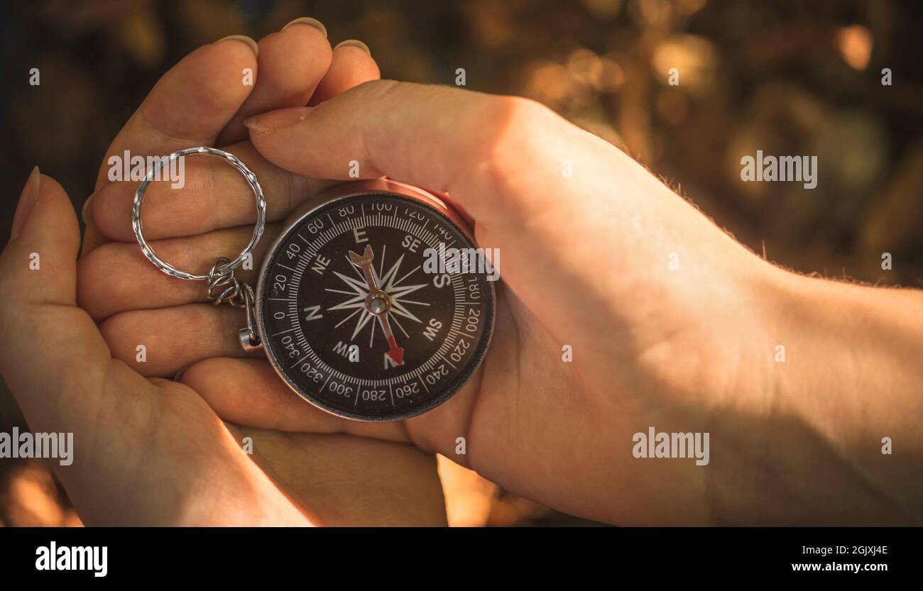 Compass in hands man close hi-res stock photography and images - Alamy