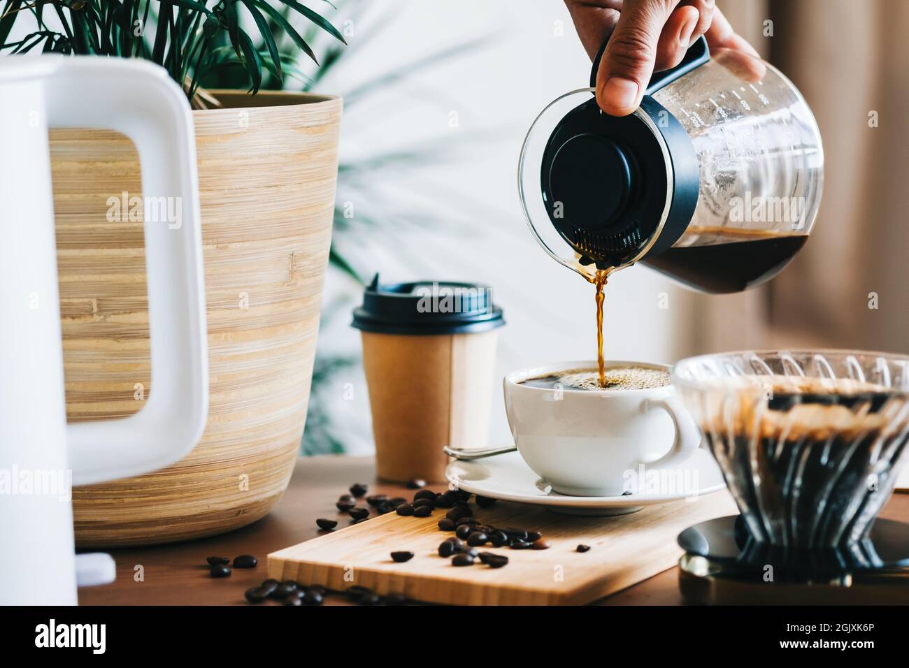 Man pouring coffee in a cup, alternative coffee brewing method, using ...