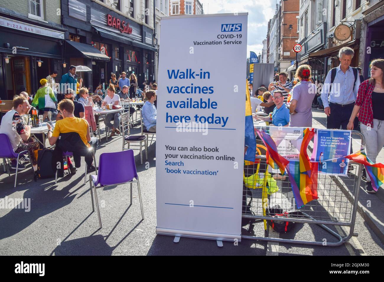 A temporary walk-in COVID-19 vaccination centre sign seen in Old ...