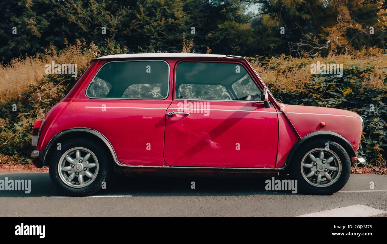 Vintage red Mini Cooper. A classic car parked on the road in London ...