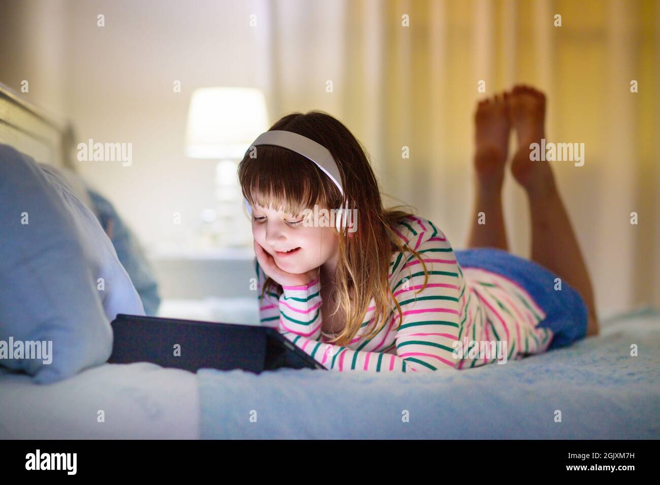 Teenager girl with tablet computer. Teen kid texting and playing online ...