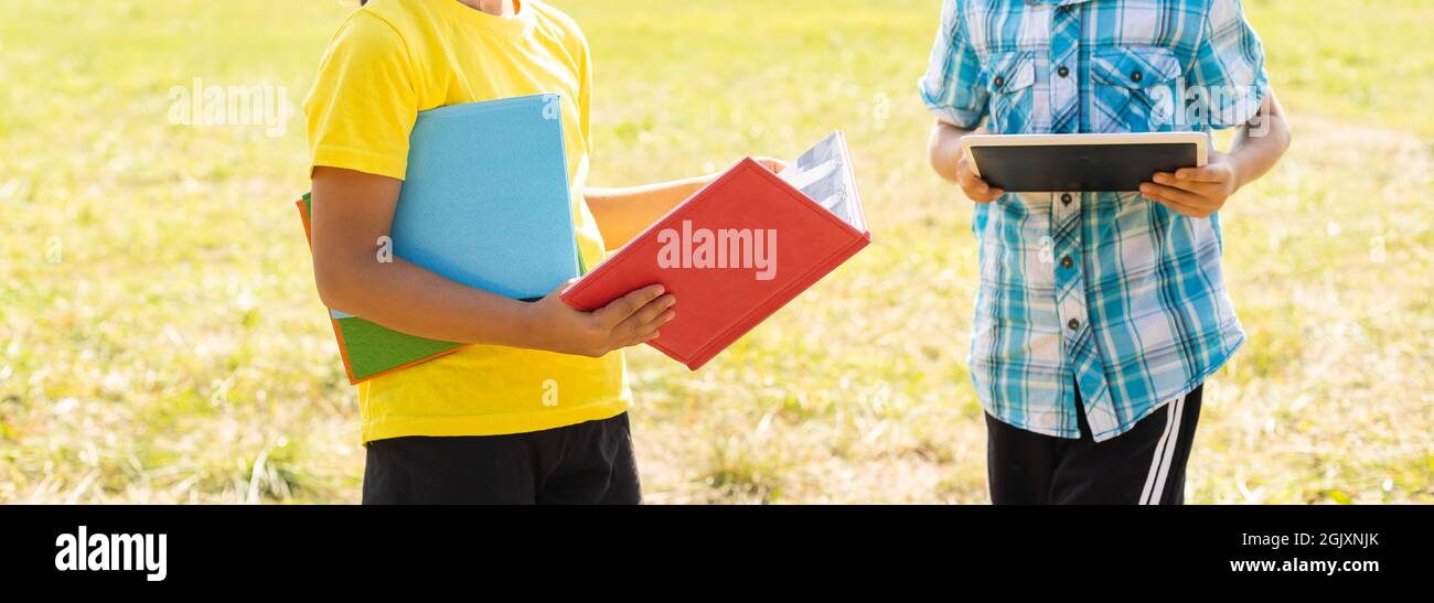 Elementary school kids having fun outdoors Stock Photo - Alamy