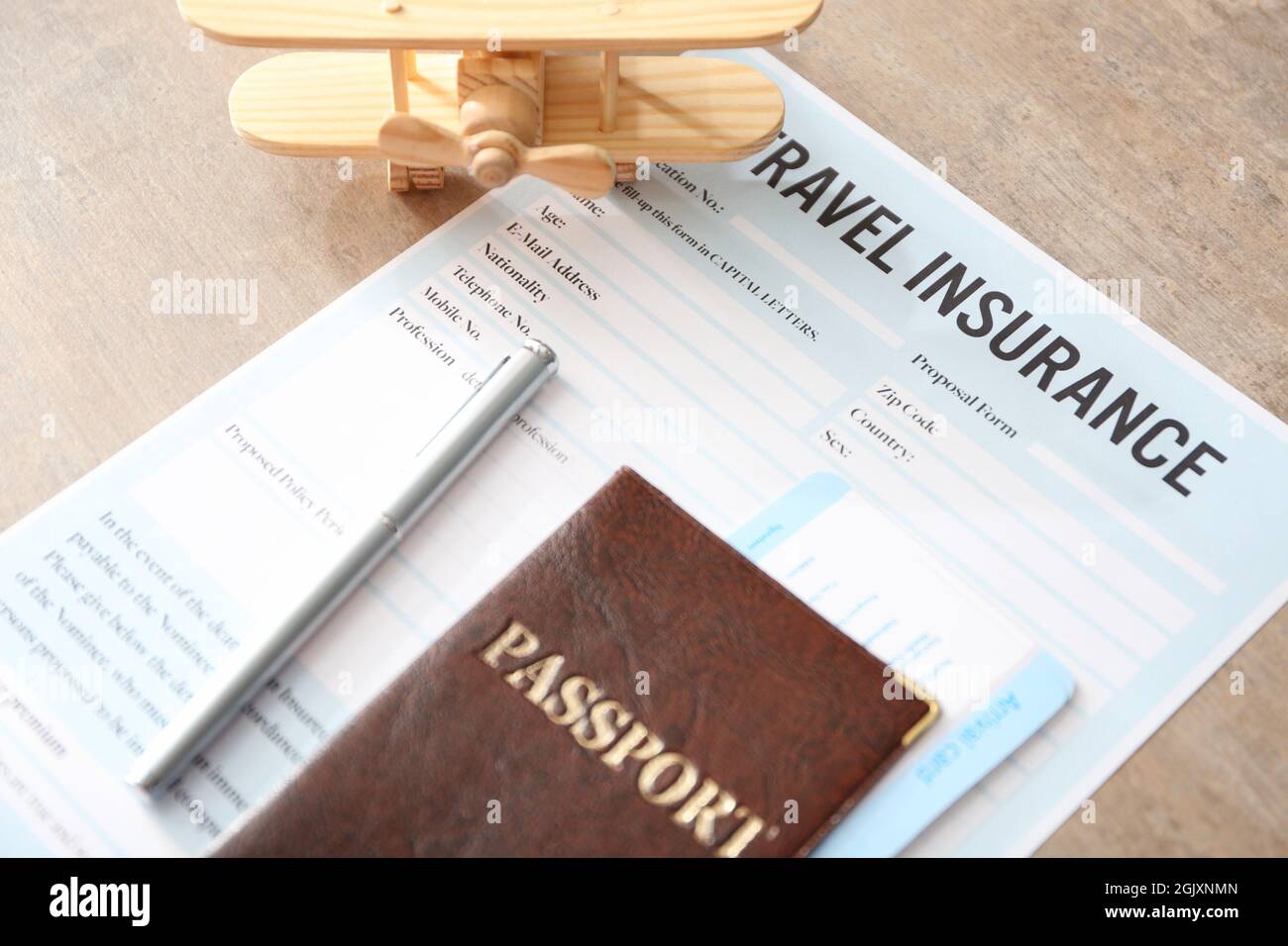Passport with arrival cards and pen on travel insurance form Stock ...