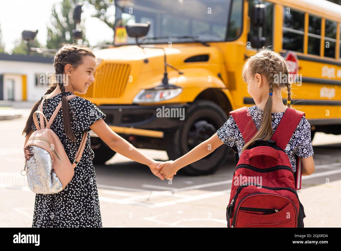 Basic school students crossing the road Stock Photo - Alamy