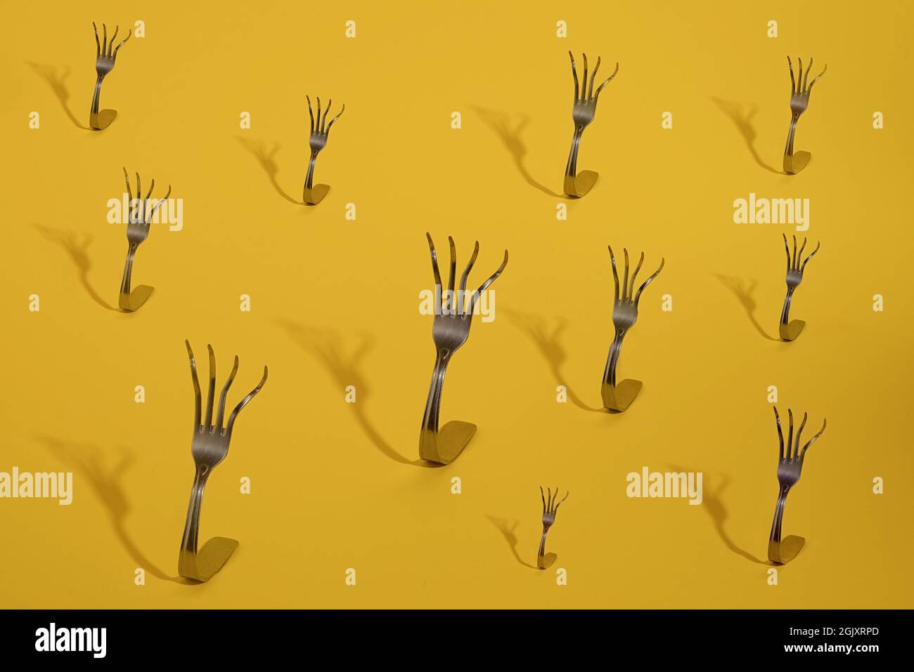 Zombie forks. Creative idea for decoration on a yellow background Stock ...