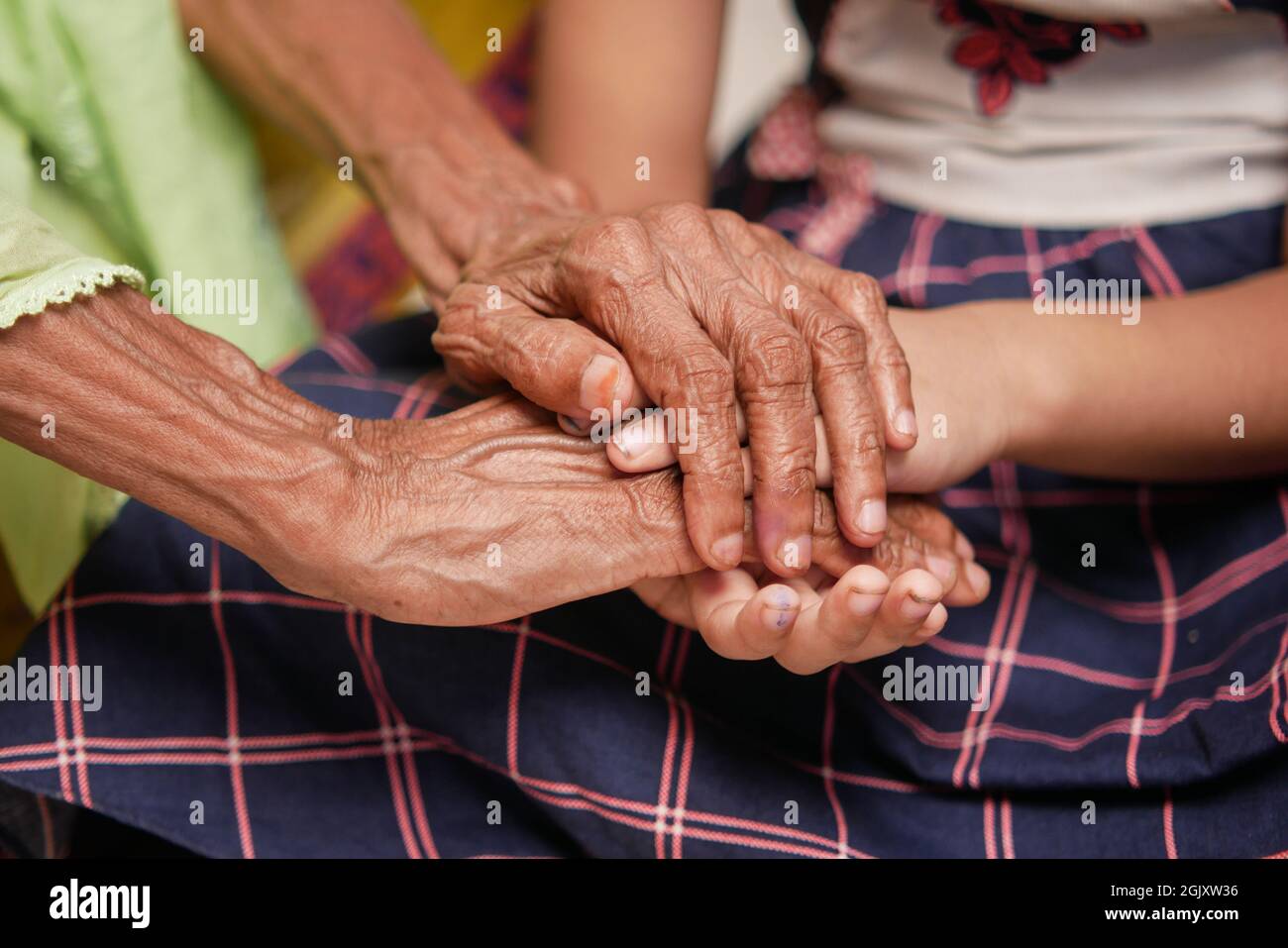 detail shot of child girl holding hand of a senior women Stock Photo ...