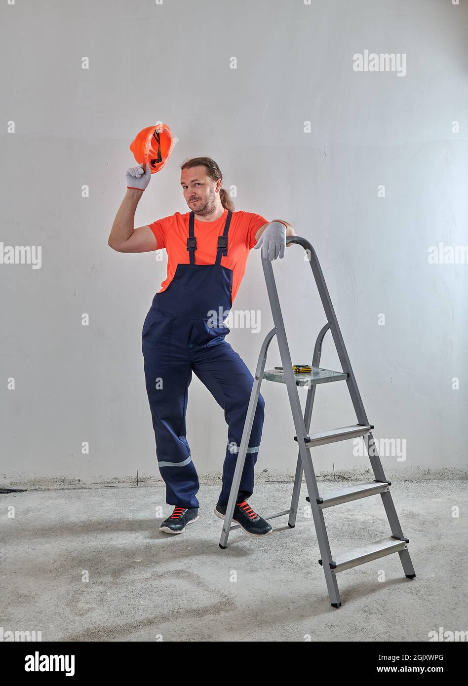 the dancing repairman leaned on the ladder Stock Photo - Alamy