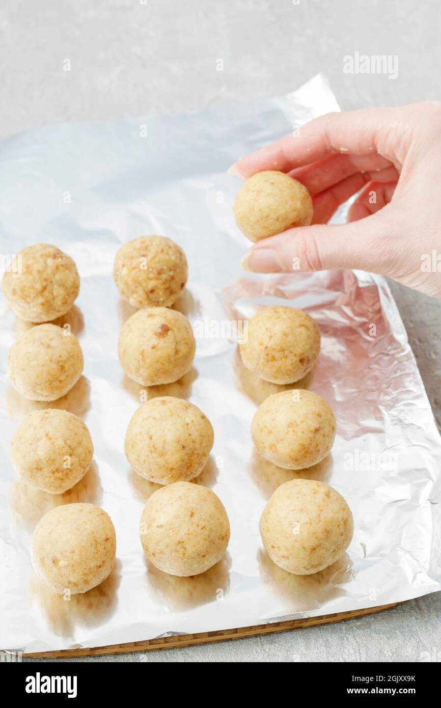 How to make cake pops - round out the cake balls with your hands. Step ...