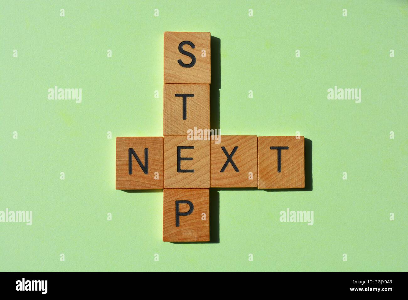Next Step, words in wooden alphabet letters in crossword form isolated ...